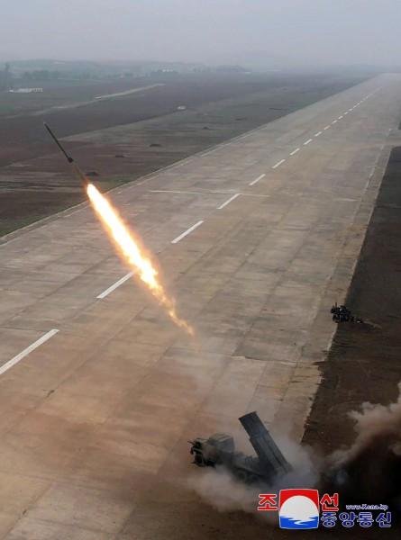 N. Korean leader inspects test-firing of new multiple rocket launcher ...