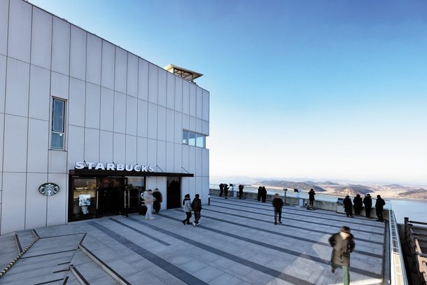 Capitalism icon Starbucks at DMZ observatory contrasts with nearby ...