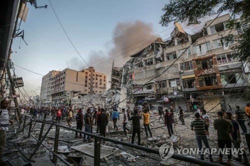 MIDEAST ISRAEL PALESTINIAN ISRAELI STRIKE AL-SHOROUQ BUILDING : 네이트 뉴스