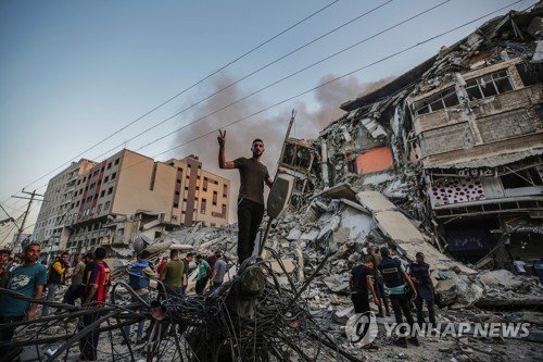 MIDEAST ISRAEL PALESTINIAN ISRAELI STRIKE AL-SHOROUQ BUILDING : 네이트 뉴스